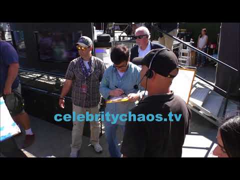 Jackie Chan gets fans excited by signing autographs