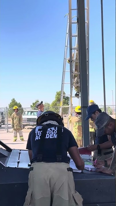 Girl climbing 35 foot ladder to deploy roof ladder - YouTube