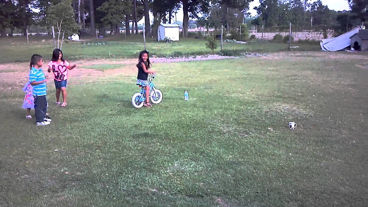 Mia learning to ride her bike at 4 - YouTube