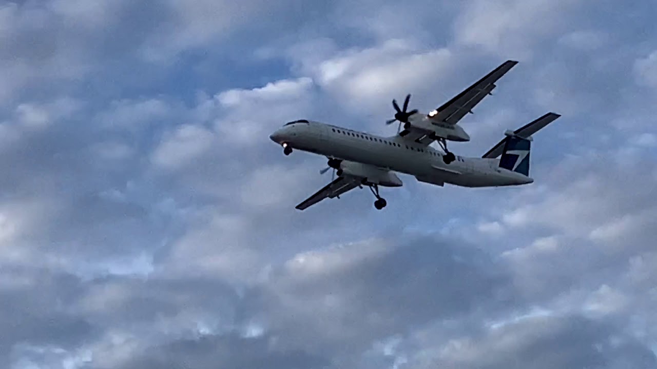 Westjet Dash 8 overhead arrival at yvr - YouTube