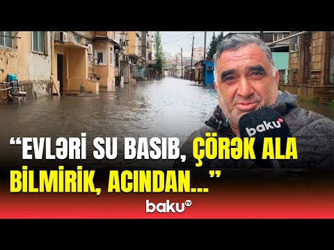 Xırdalanda yağış həyatı dayandırdı | Uşaq qalıb o tərəfdə, keçə bilmir...
