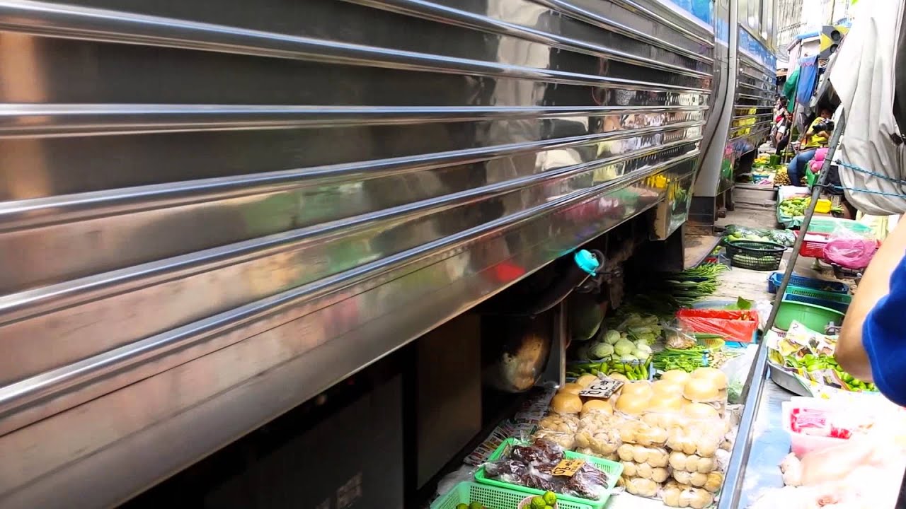 Maeklong Railway Market: train passing through! - YouTube