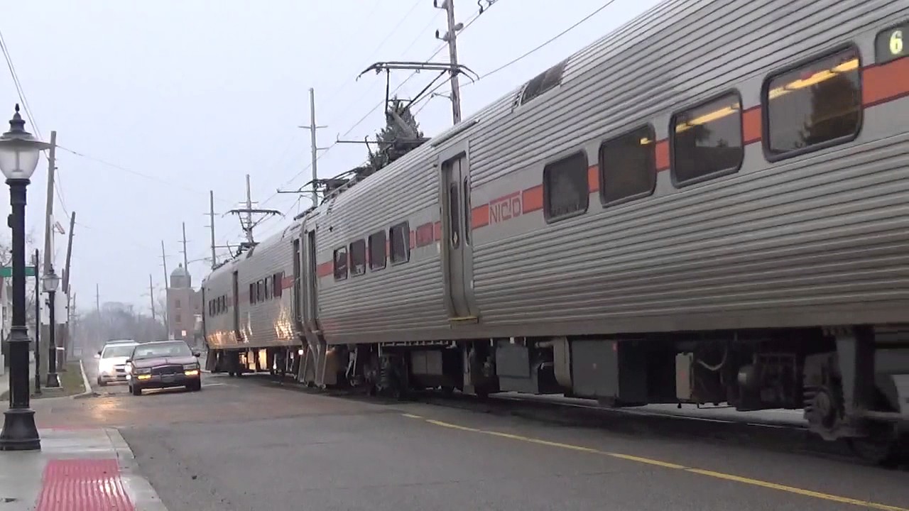An Outbound South Shore Line NICTD Street Running Arrives/Departs 11th ...