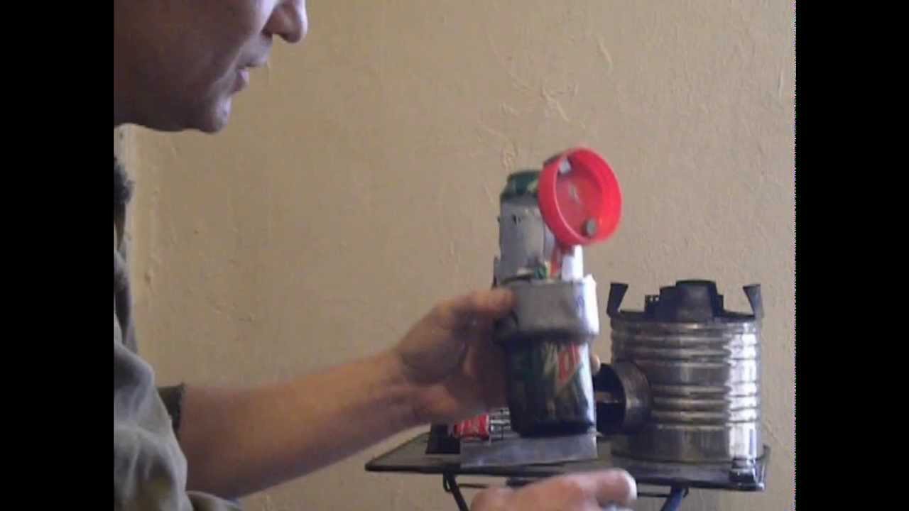 Pop can Stirling Engine on a Rocket stove - YouTube