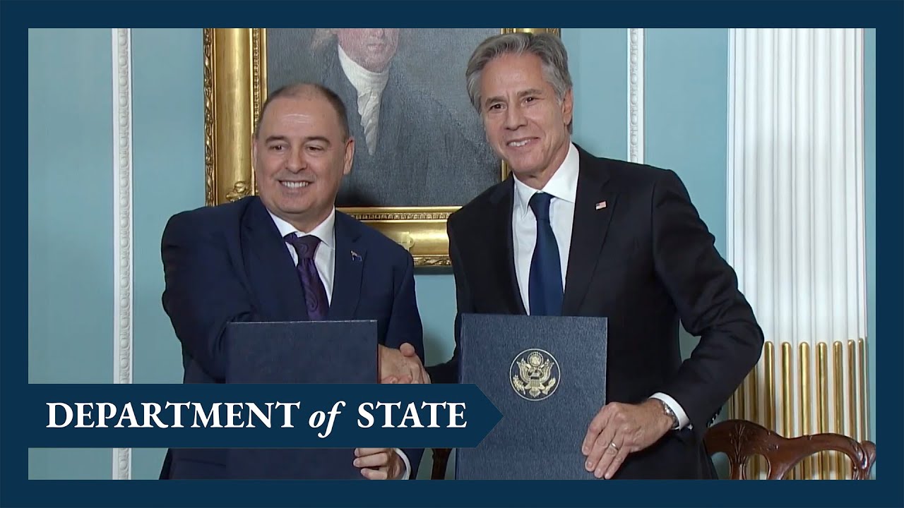 Secretary Blinken at a joint statement signing ceremony with Cook ...