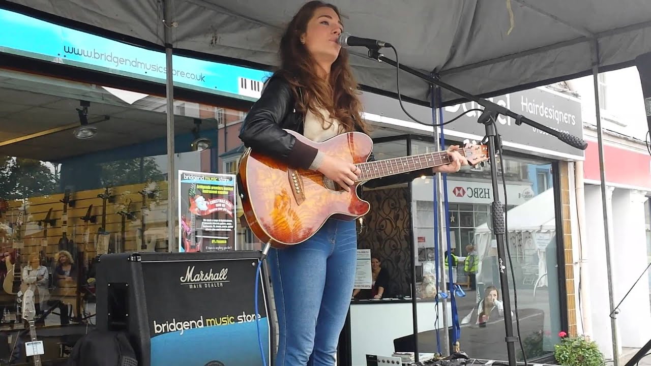 Izzi Grace playing outside the store. - YouTube