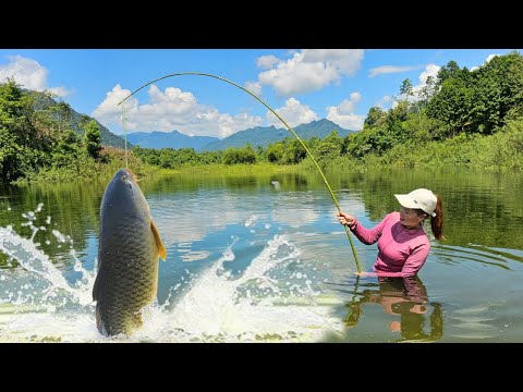 Girl fishing by traditional method. Unexpectedly caught a big fish.