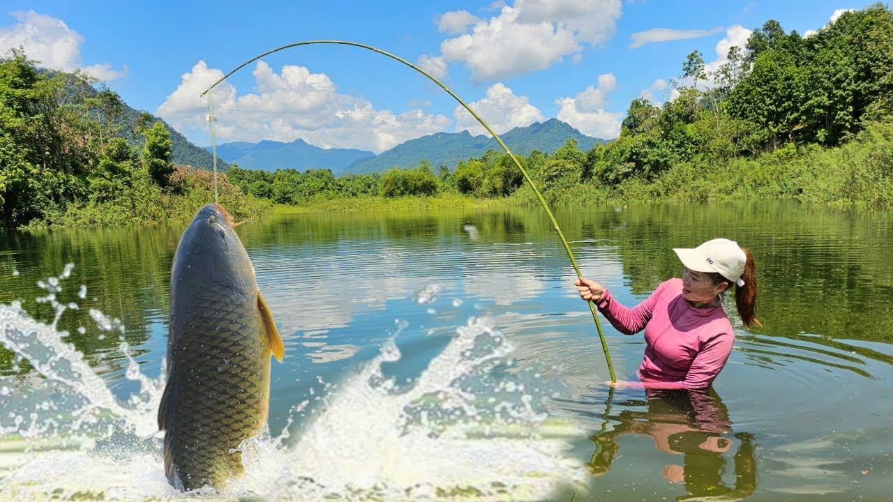 Girl fishing by traditional method. Unexpectedly caught a big fish ...