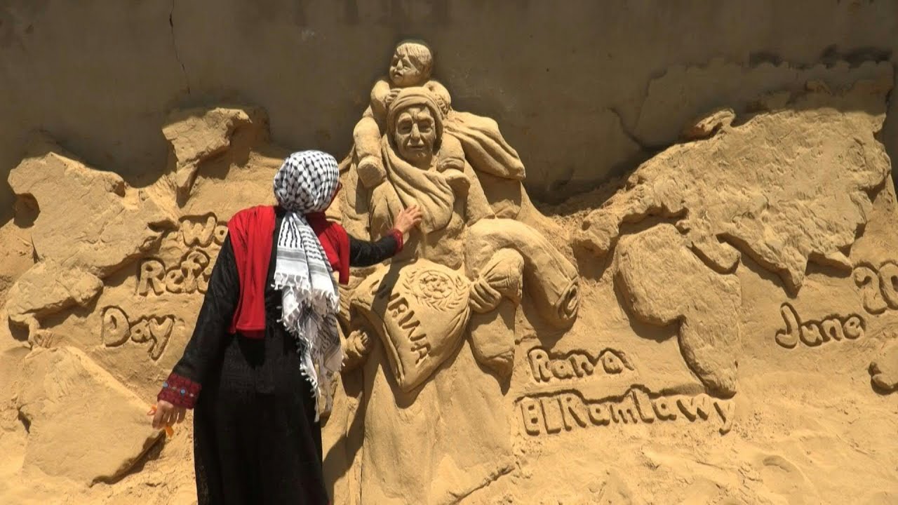Palestinian artist carves sand sculpture for World Refugee Day | AFP ...