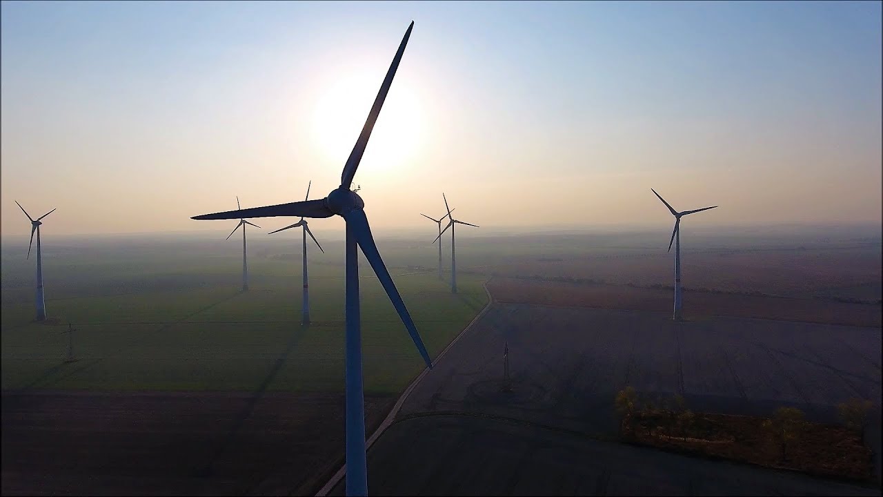 Enercon E-66, E-70, E-82, E-115 Wind turbines from the air with sunset ...