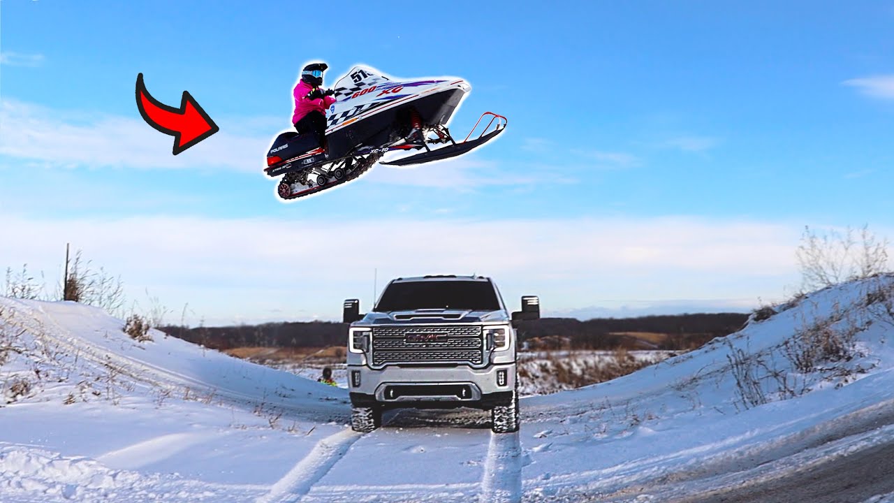 Snowmobile Jumps OVER Truck! - YouTube