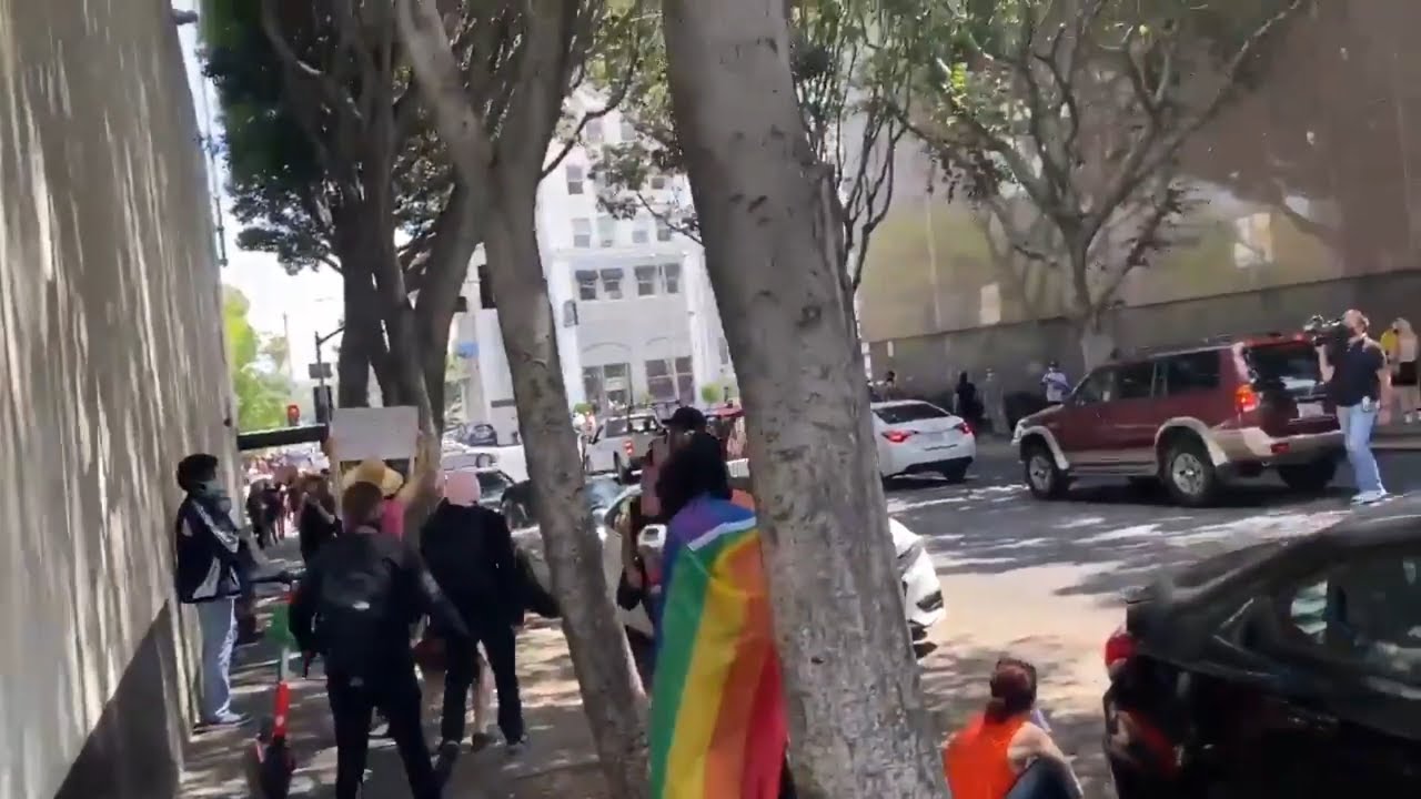 Angry Antifa mob harras a middle aged woman who said her glasses were ...
