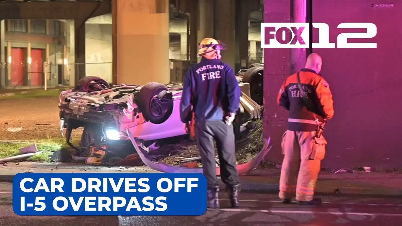 One hurt after car drives off I-5 overpass in Portland - YouTube