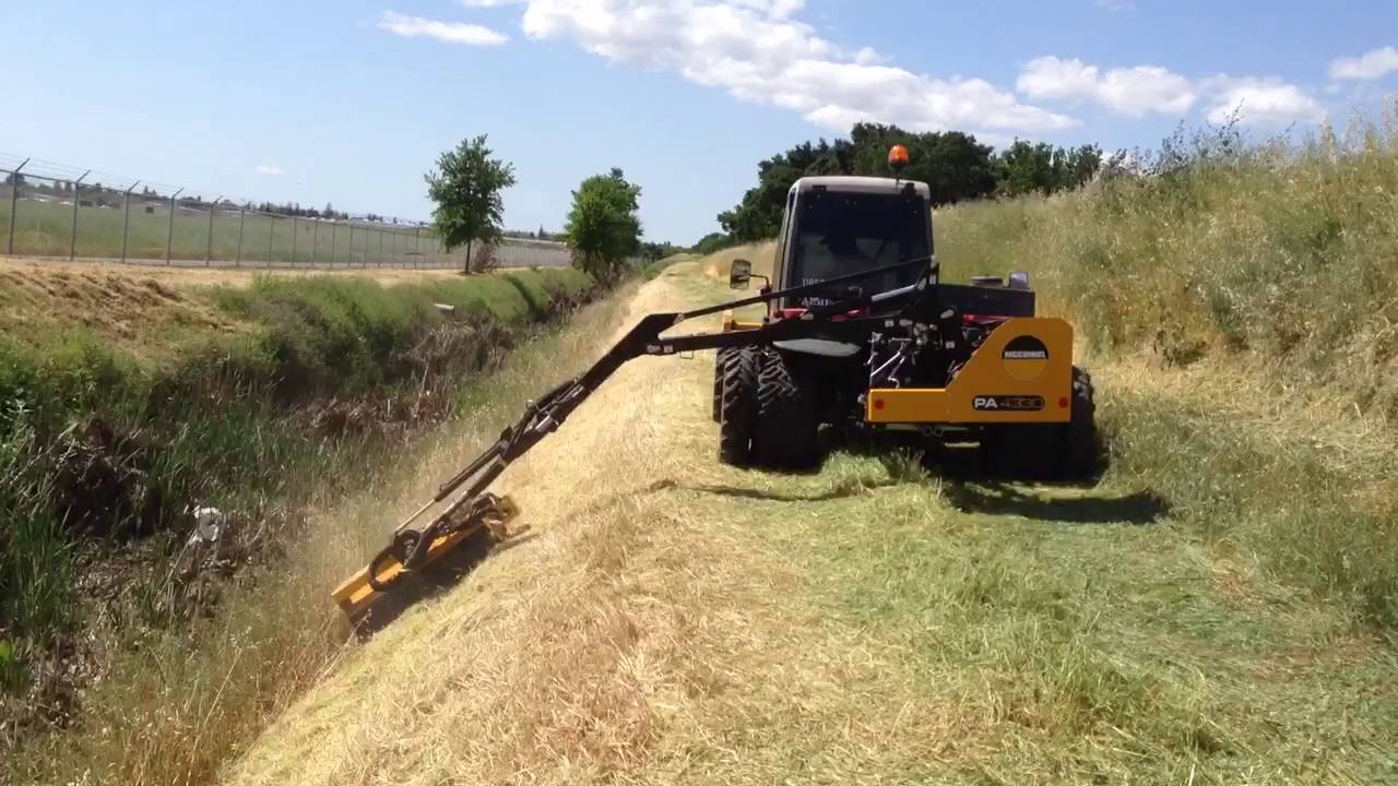 Aebi TT270 and McConnel boom mower - YouTube