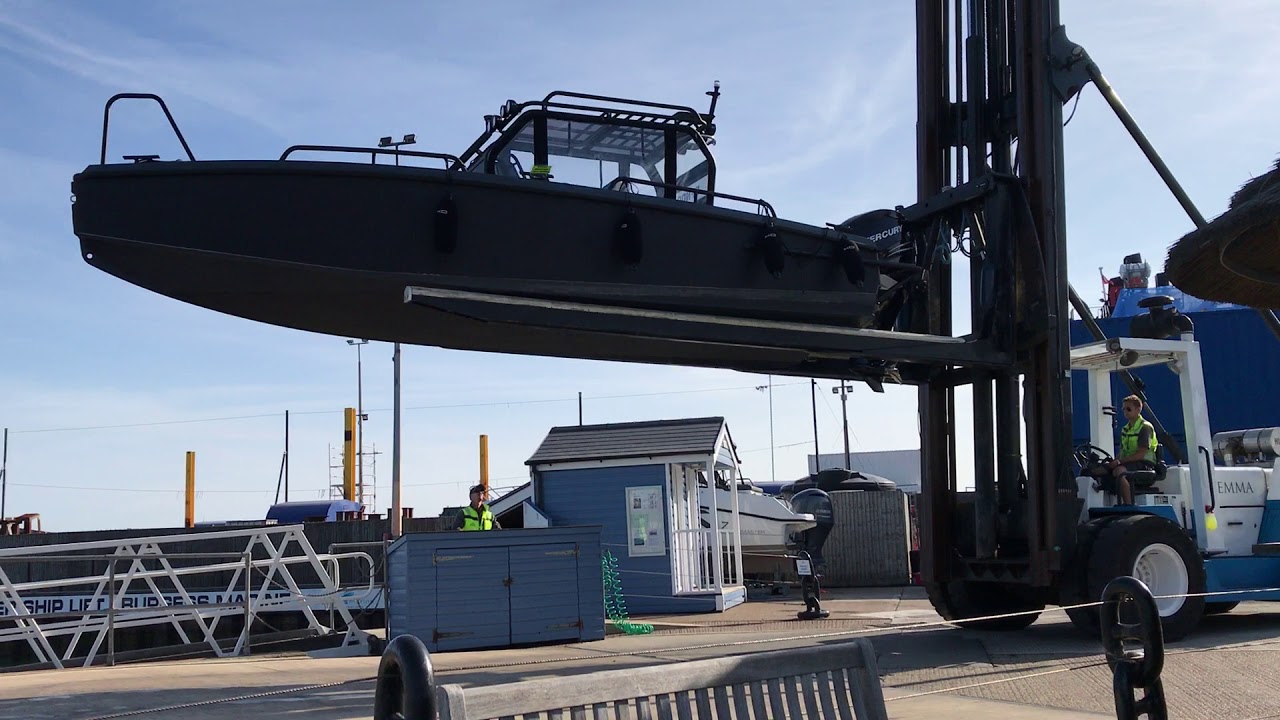 Launching an XO Boats' Defender (XO DFNDR) by forklift from a drystack ...