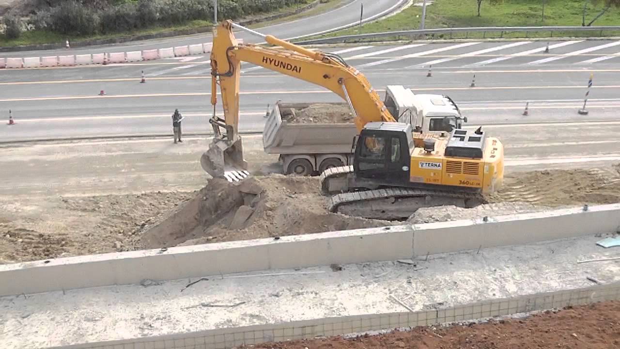 HYUNDAI 360 LC7A loading trucks in slope Part 1 - YouTube