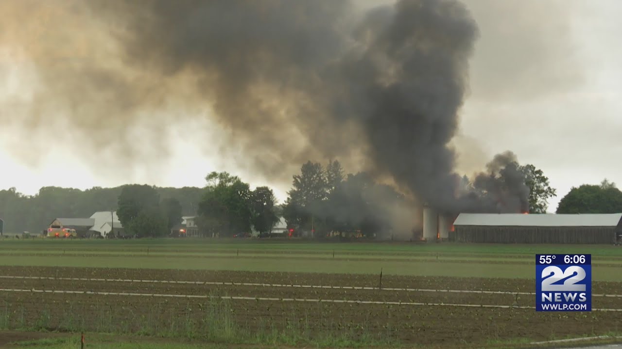 Local fire crews work to put out large Amherst barn fire - YouTube