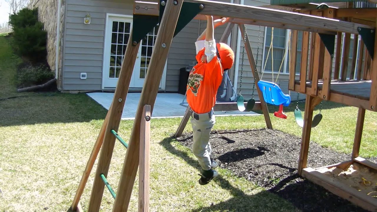 Adrian on the monkey bars - YouTube