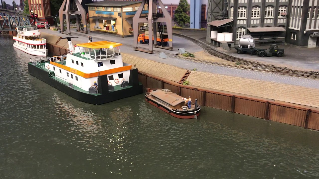 Layout combining port and foundry train activities - YouTube