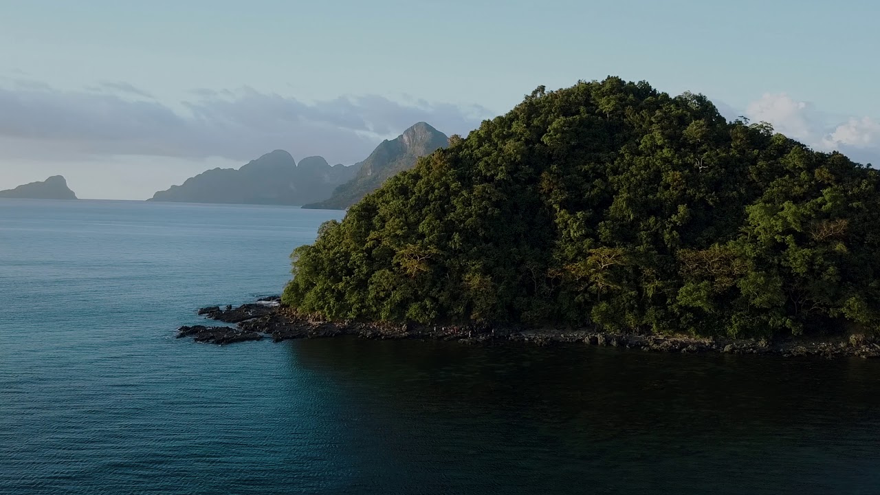 Beautiful Lush Island on the Ocean with Distant Hikers | Stock Drone ...