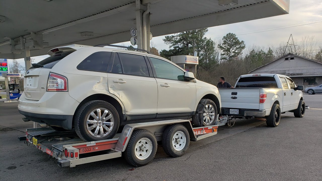 Cómo remolcar un automóvil con un tráiler o dolly alquilado - YouTube