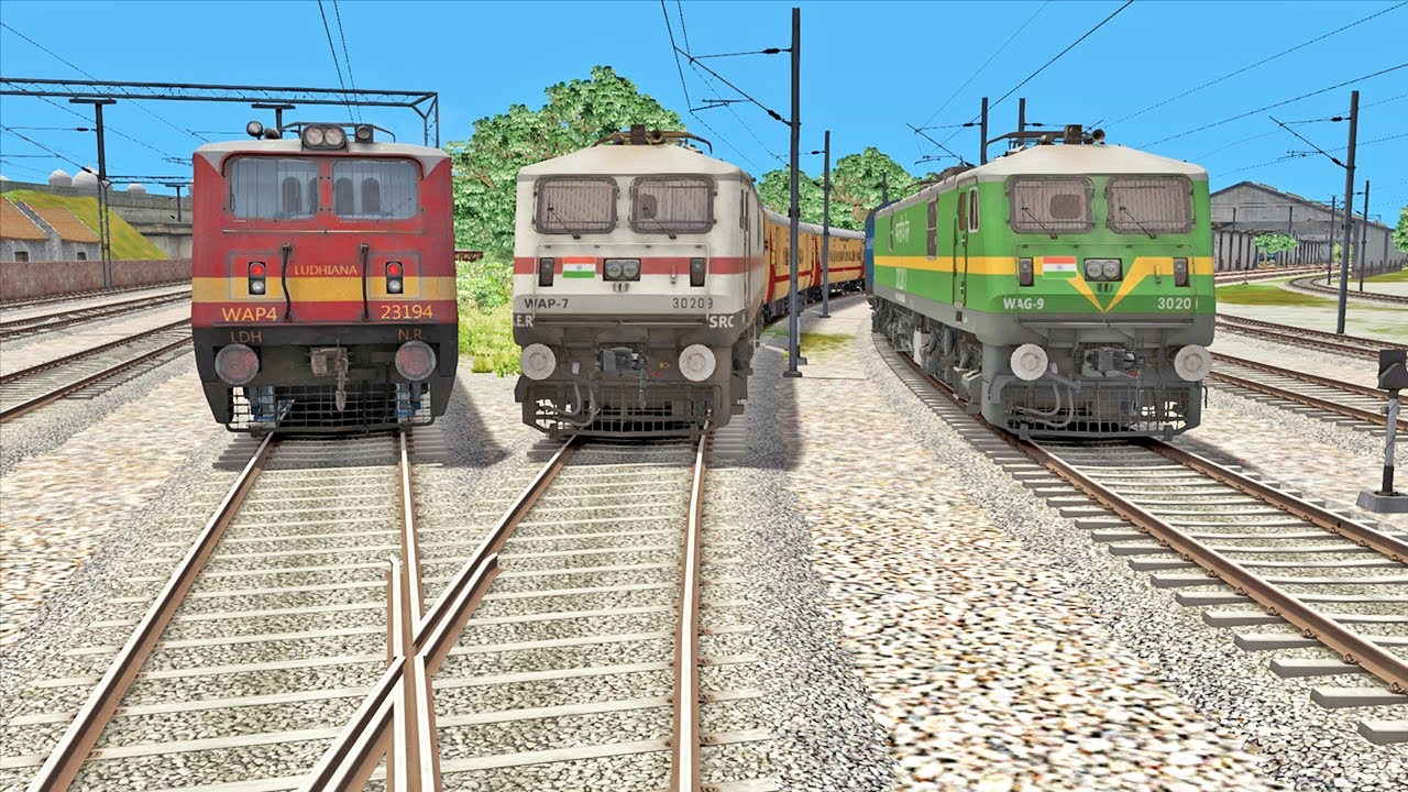 Three Trains Running Through Diamond Railroad Crossing To Platform ...