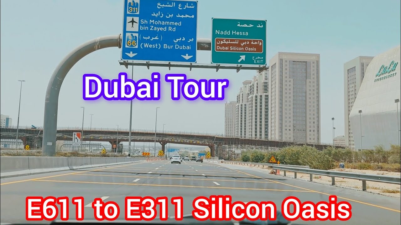 Driving from E611 to E311 Silicon Oasis. Skyscrapers in Dubai. E66 ...