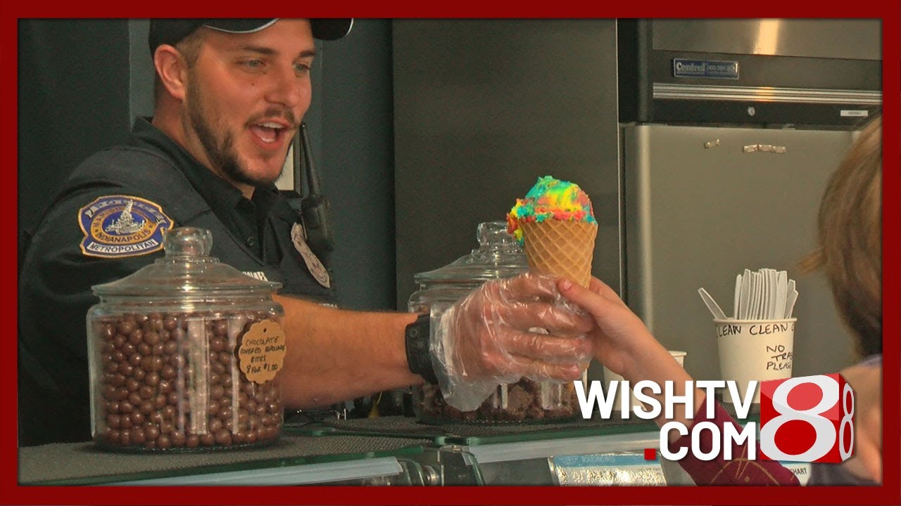 Indianapolis police officers serve ice cream at Cops & Cones - YouTube