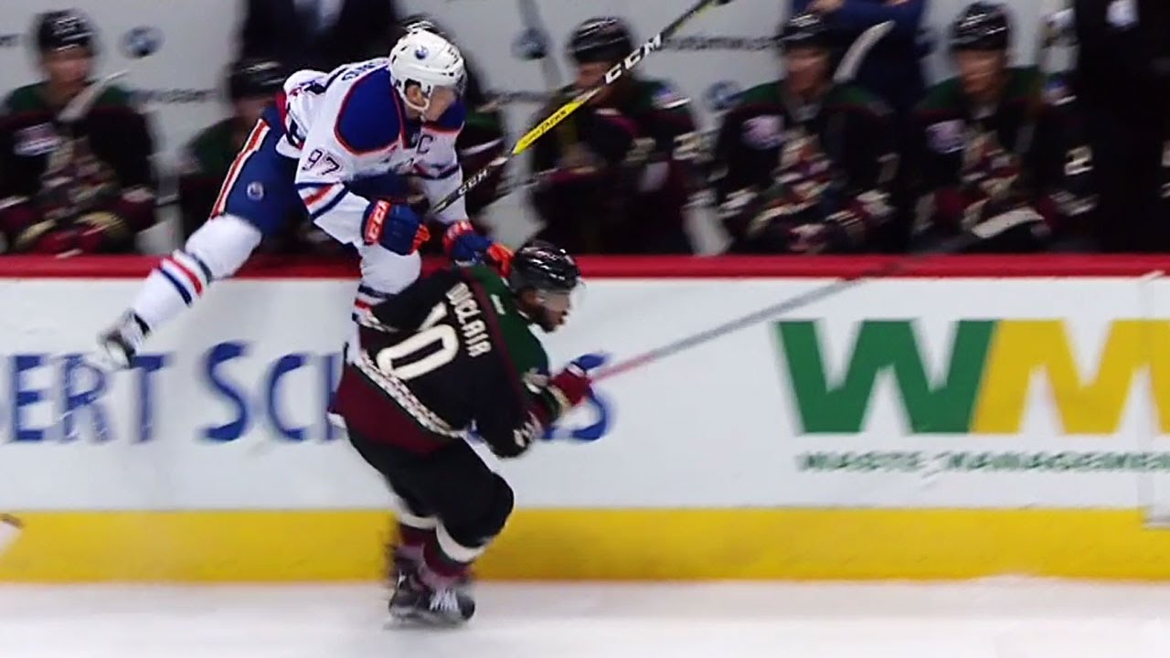 McDavid soars into Coyotes bench avoiding Duclair hit - YouTube