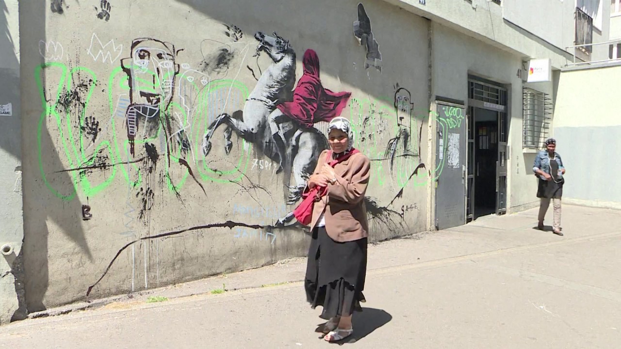 New 'Banksy' artwork appears on fire exit of Paris attack site - YouTube