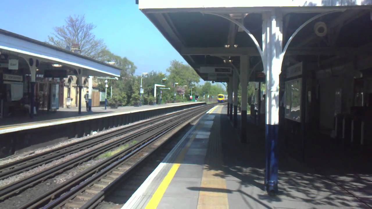 London Overground trains and D78 Stock District Line trains arriving ...