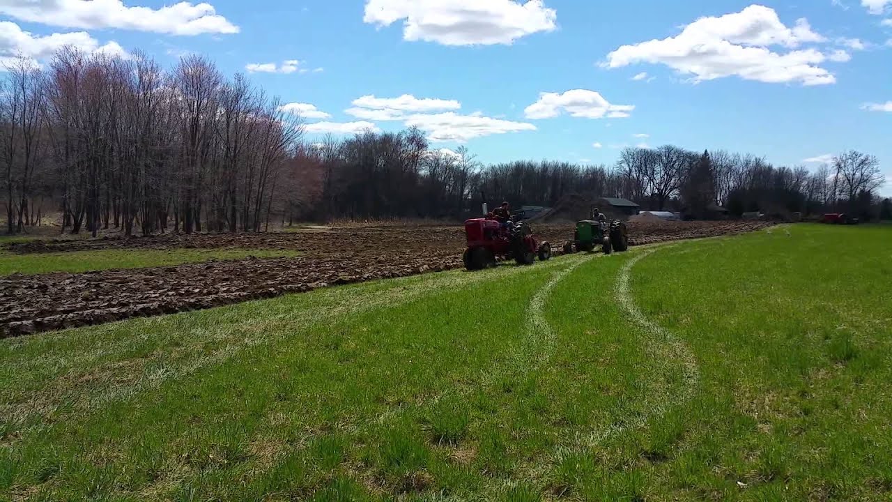 Farmall M and John Deere 2020 plowing - YouTube