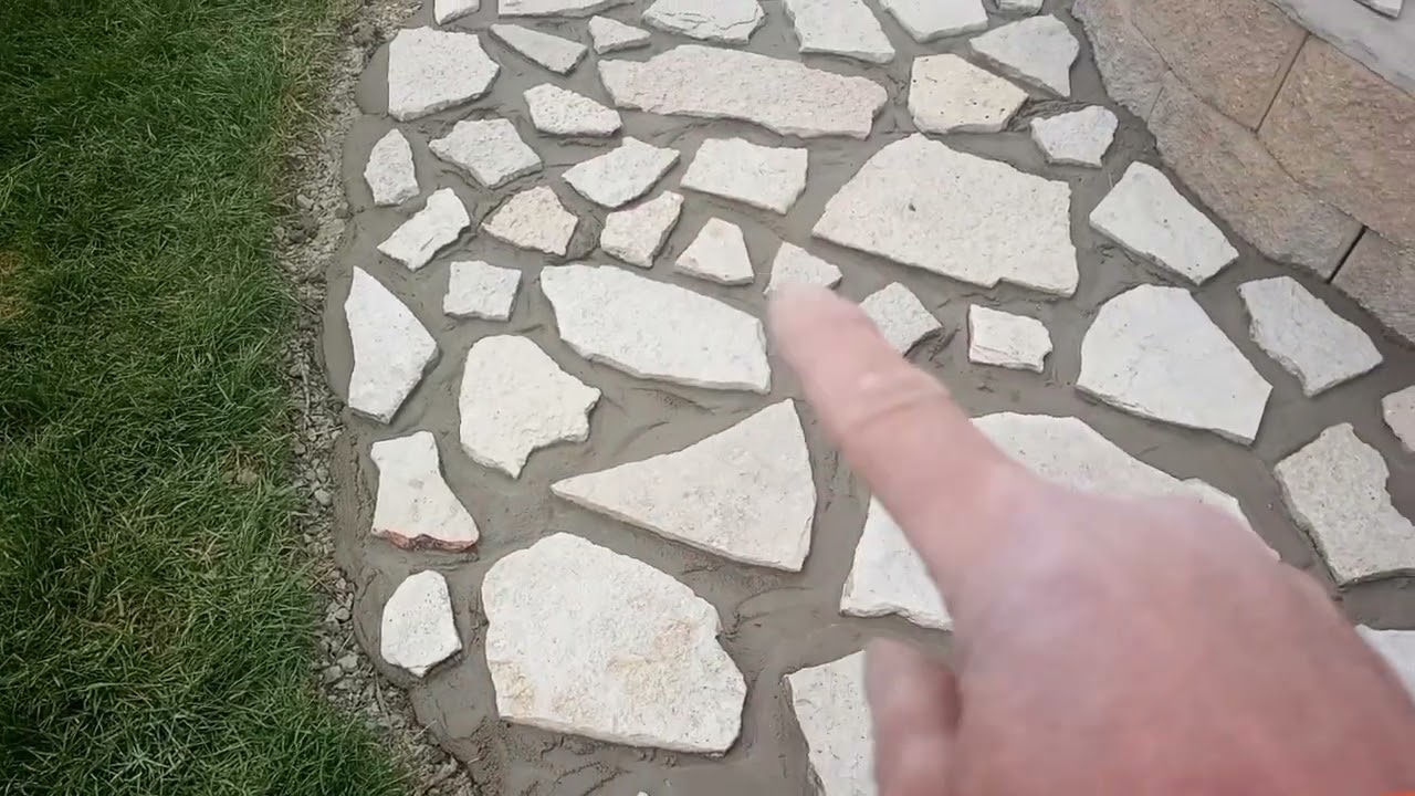 laying down real flagstone on top of cement stabilization. - YouTube