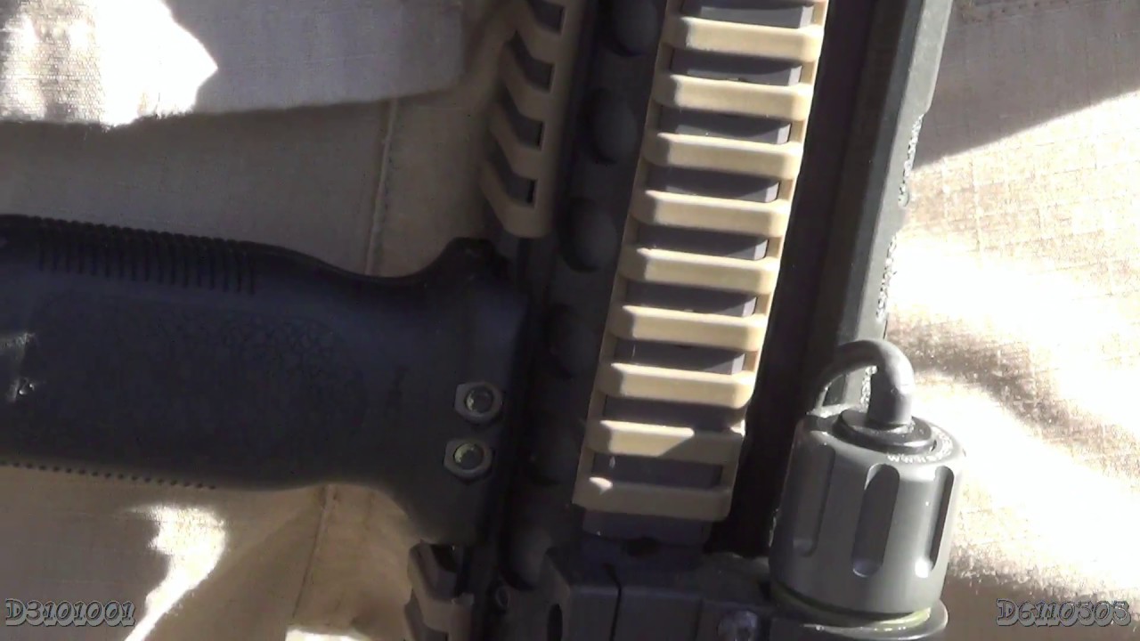 modified M4 carbine with EOTech reflex sight and frontal grip (closeup ...