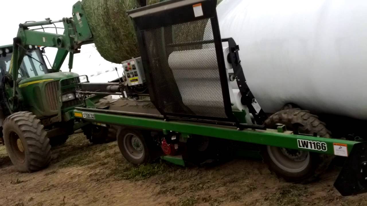Storing hay with a frontier wrapper - YouTube