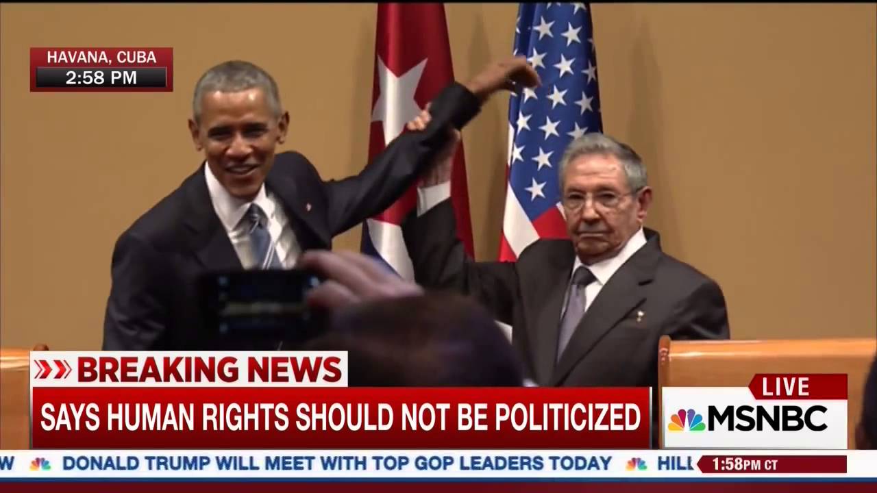 Raul Castro raises President Obama's limp arm - YouTube