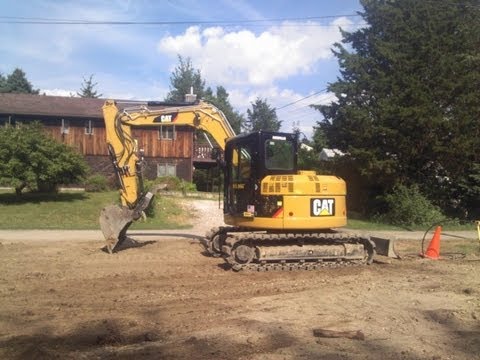 Cat 308D CR SB plugging away with progressive link thumb - YouTube