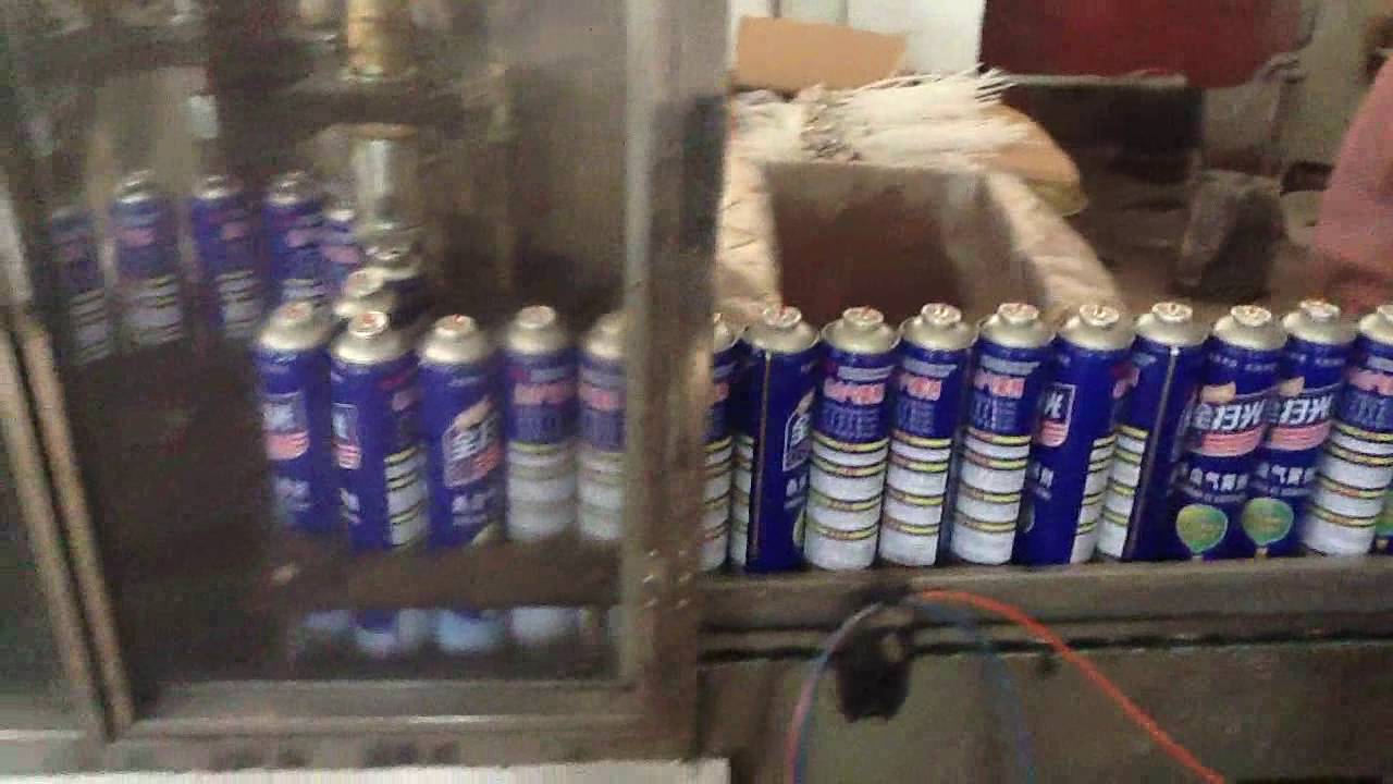 MIC-Automatic aerosol cans filling and capping machine - YouTube