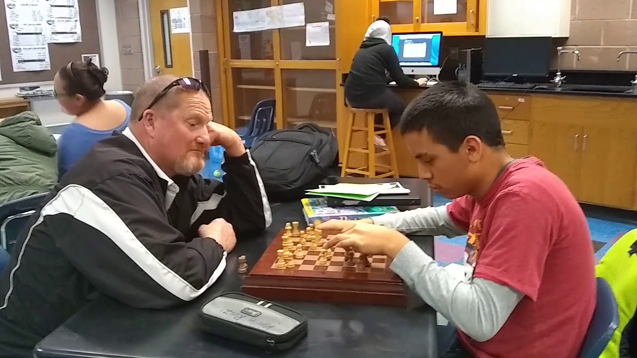 Teacher playing chess game with a student . - YouTube