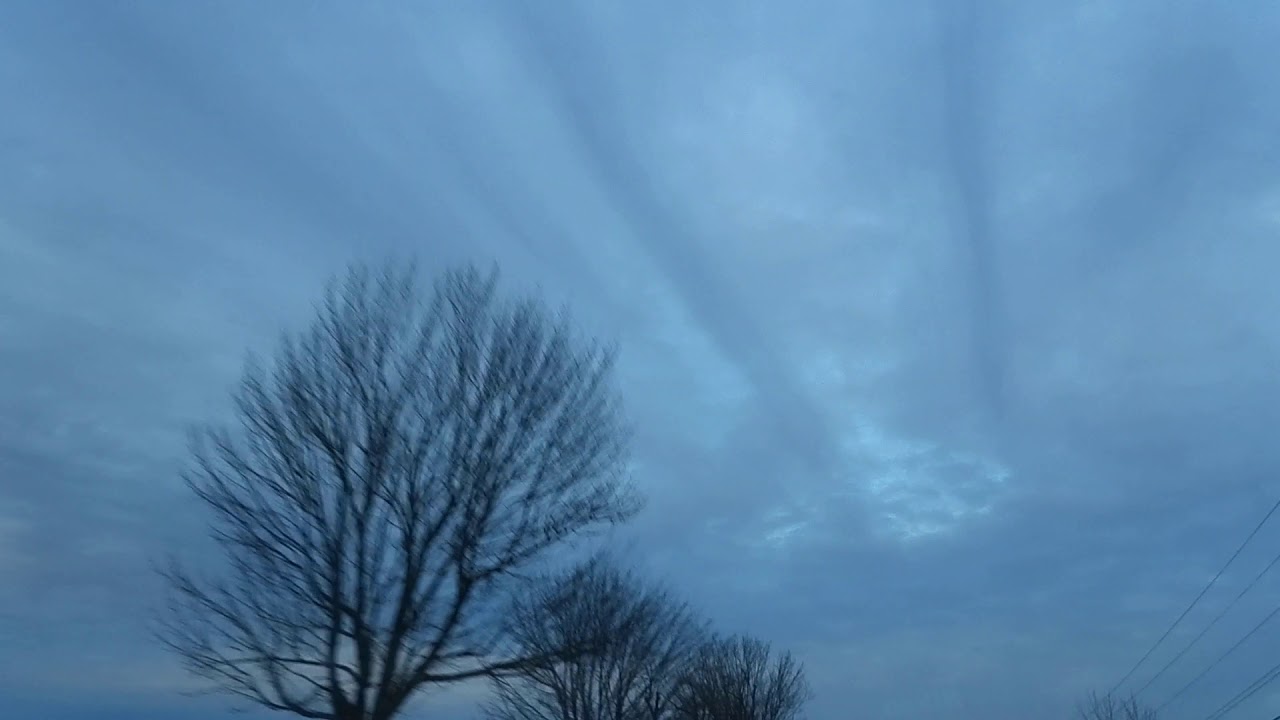 Black Streaks through Strange color clouds/skies - YouTube