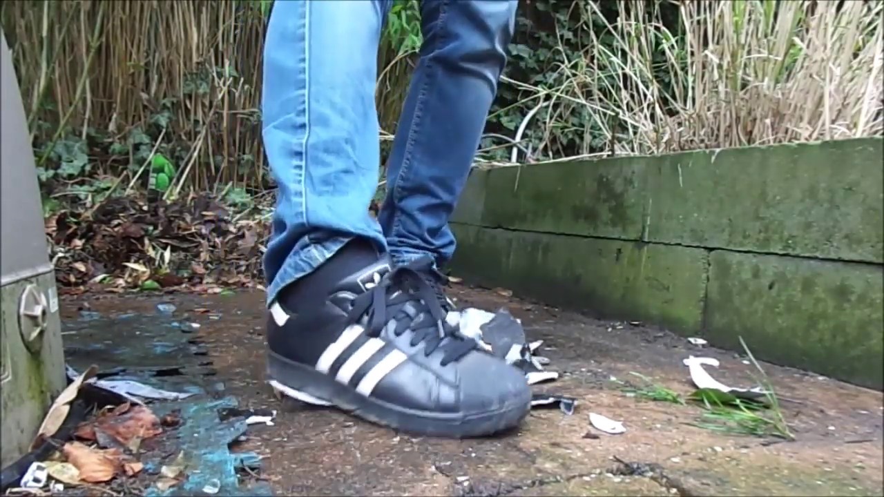 Adidas Superstars stomp, trample and destroy model world globe souvenir ...