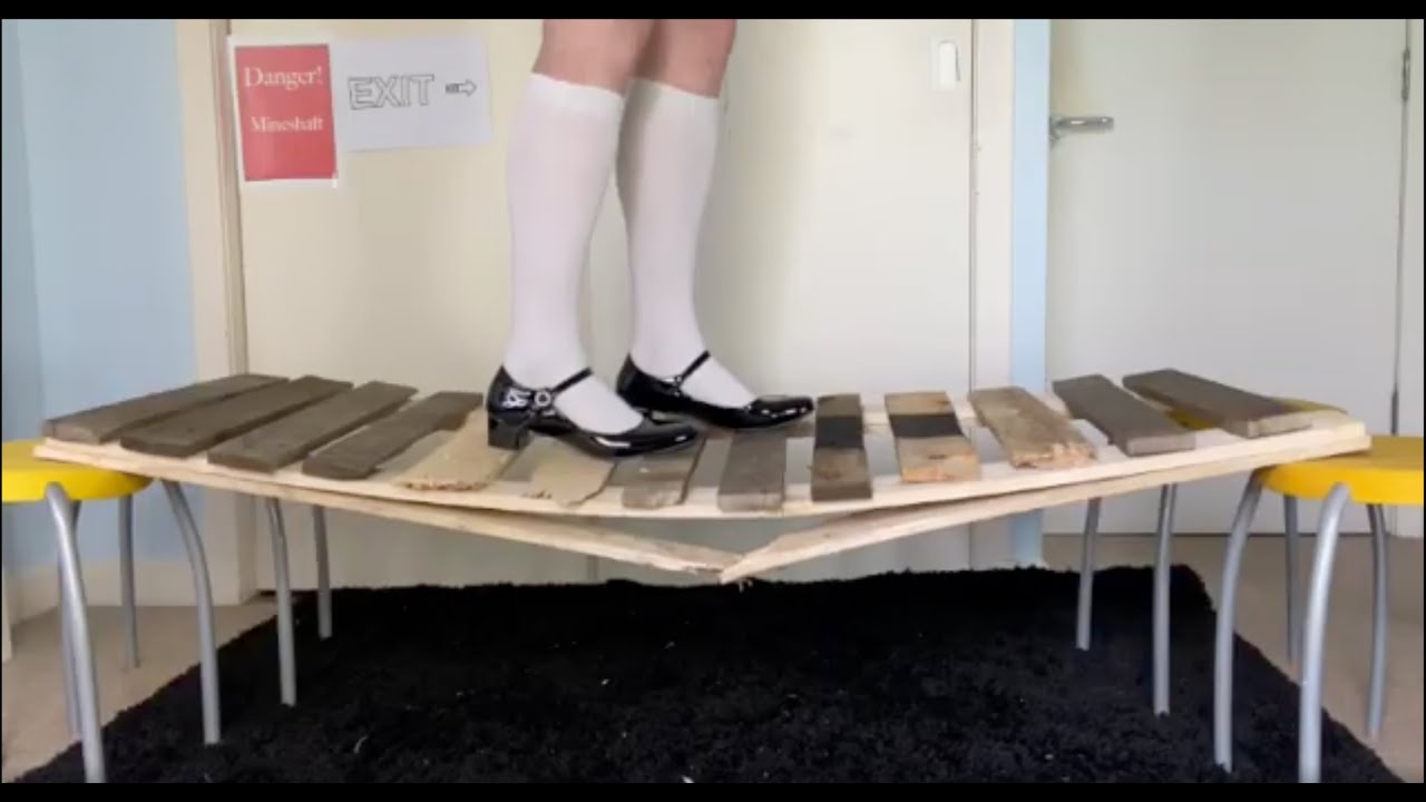 ”J-Pop group” crosses wooden bridge with broken beam over bottomless ...