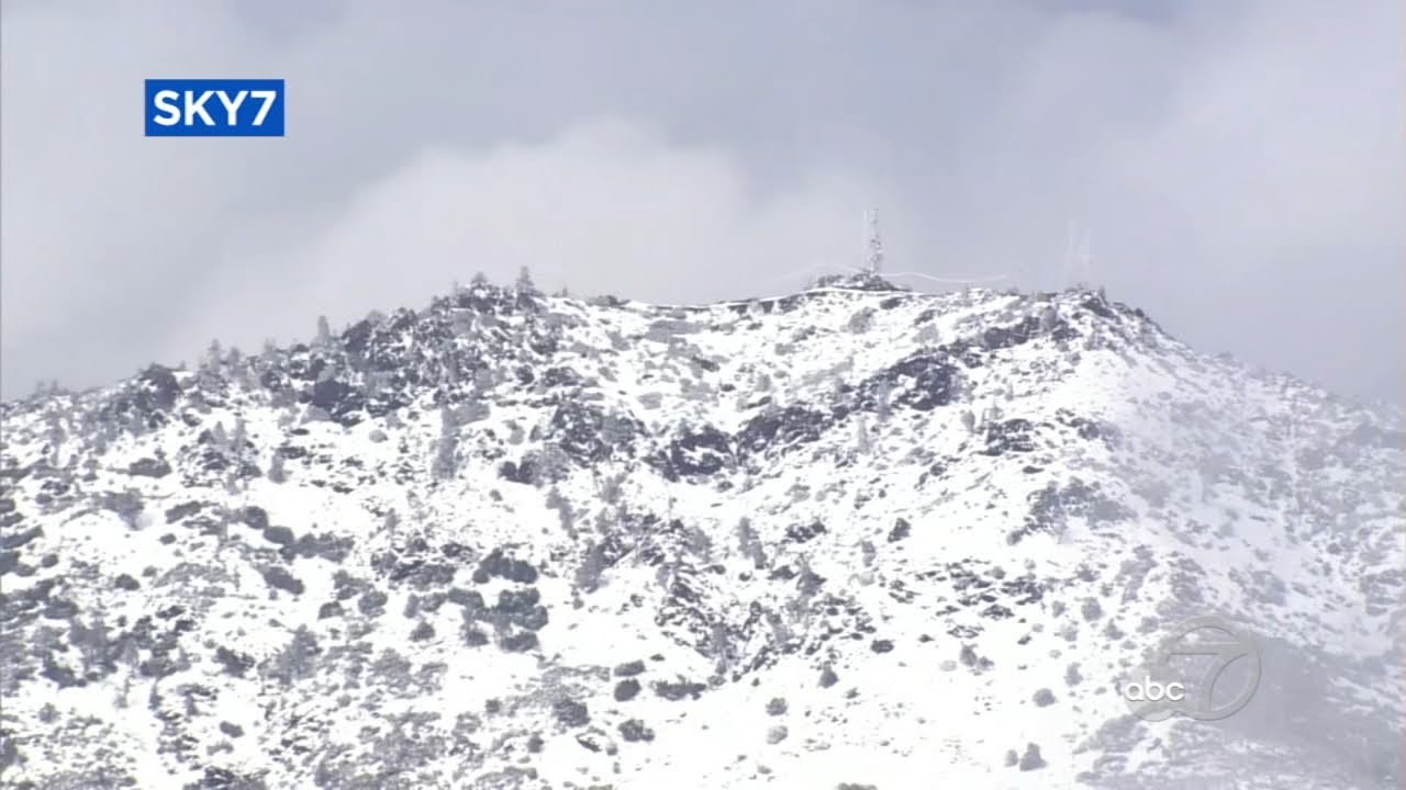 Aerial tour of Northern California snow-capped mountains, hills - YouTube