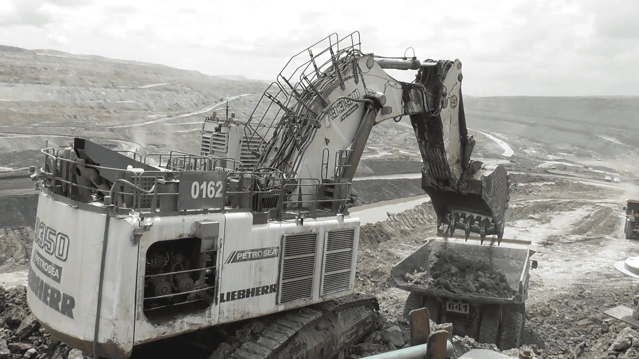 LIEBHERR R9350 EXCAVATOR LOADING CAT 777 & KOMATSU HD 785 ~ MINE ...