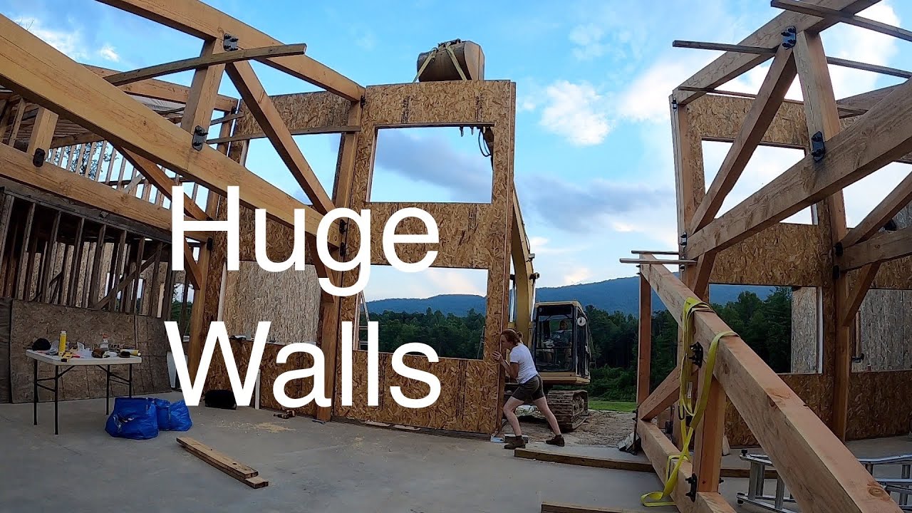 SIPs panel construction on Timber Frame house. Married couple builds ...