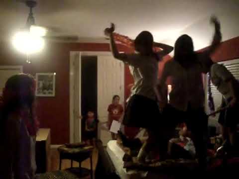 a lot of girls jumping on the bed