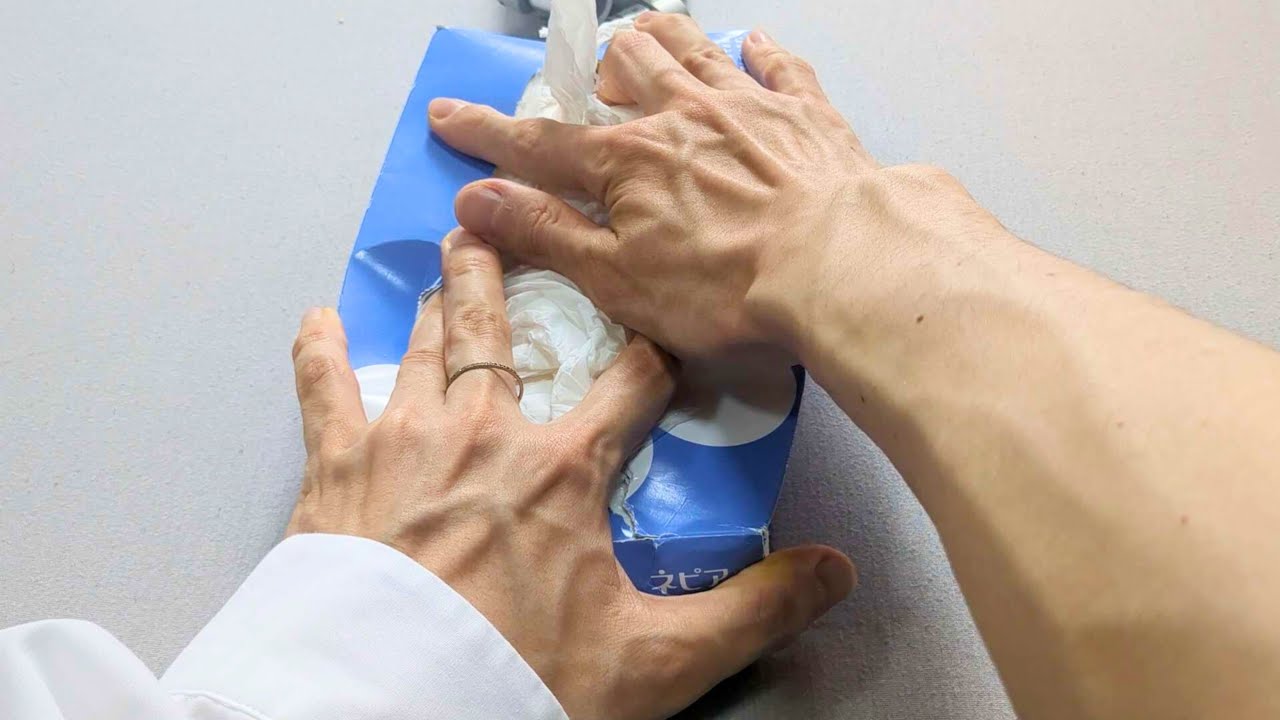Role play where two people touch the important places on a tissue box ...
