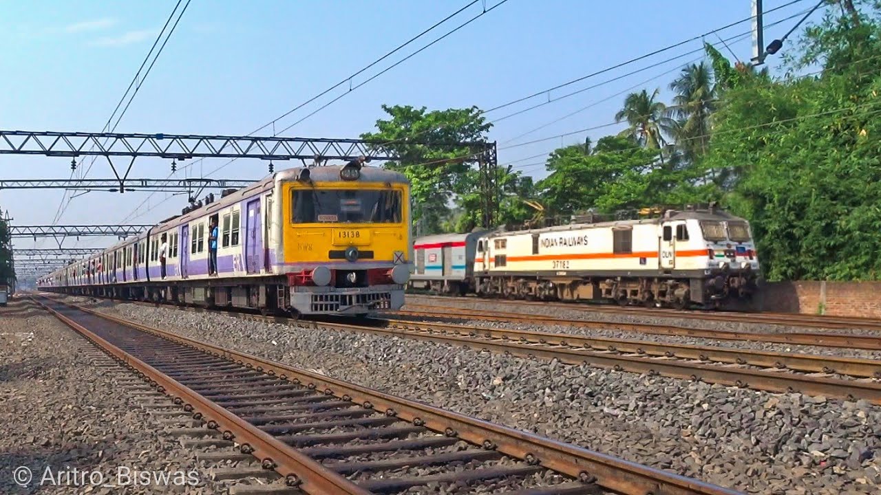 Superb speedy local train perfect timing parallel crossing with POORVA ...