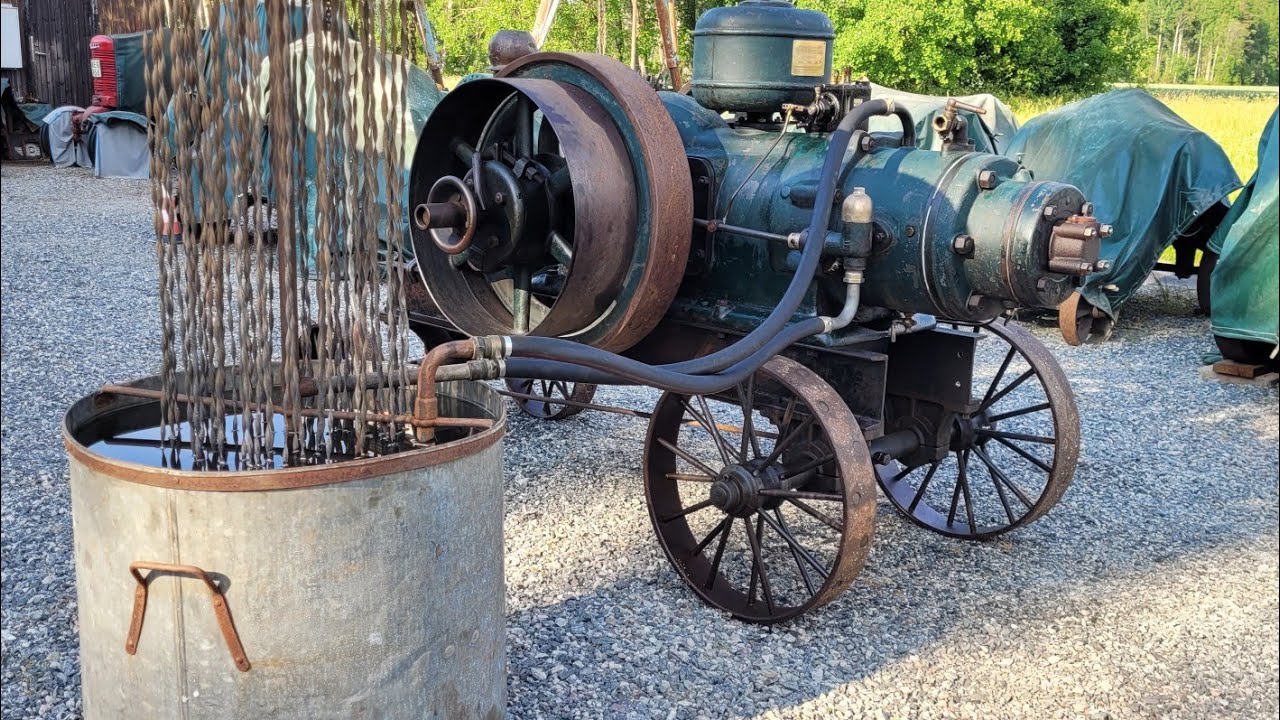 Big 1-cylinder 40 hp hot bulb stationary engine running at low rpm ...