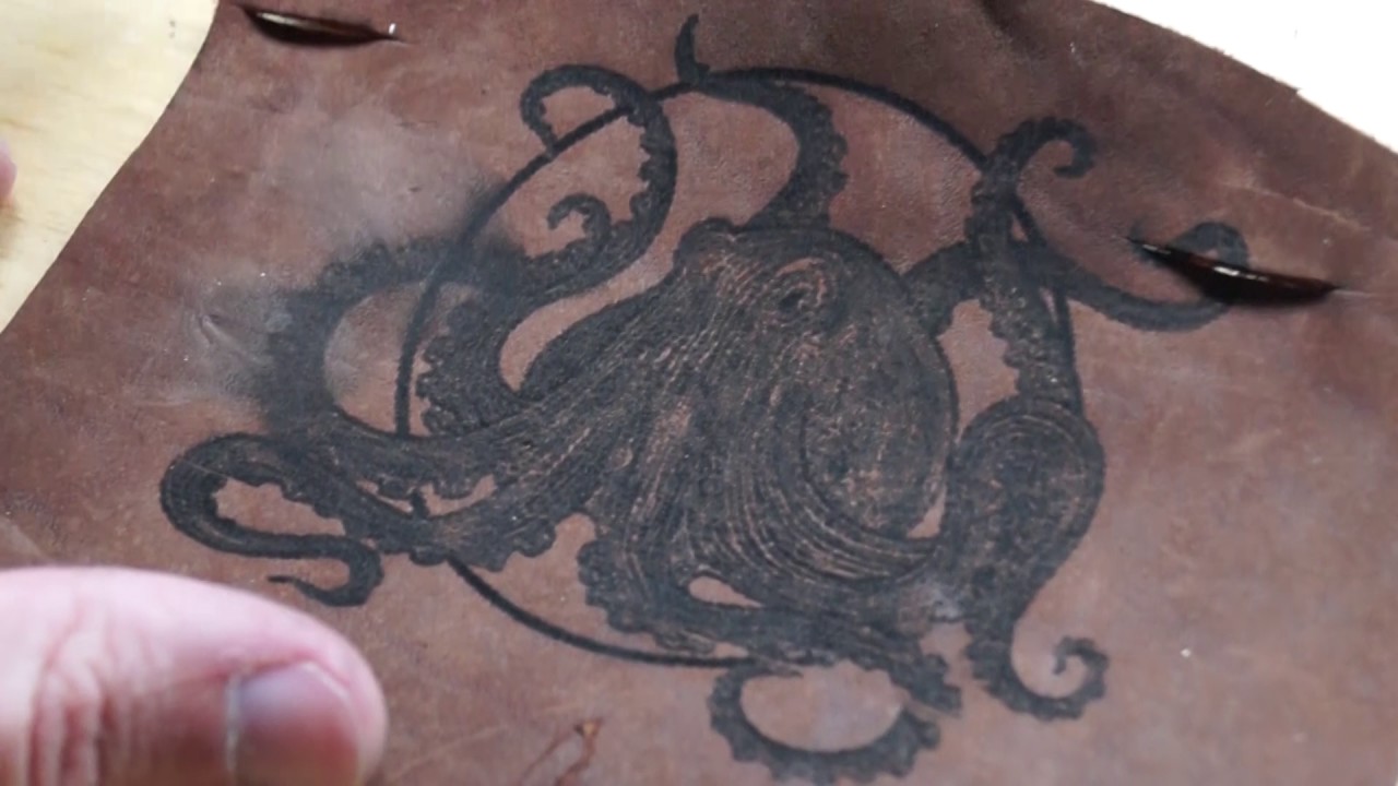 laser etching an octopus in leather and wood - YouTube